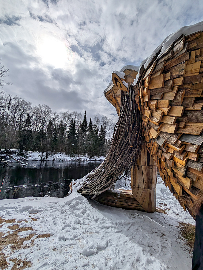 Winter transforms Benny into a snow-dusted sentinel, his wooden frame contrasting beautifully against the serene frozen landscape.