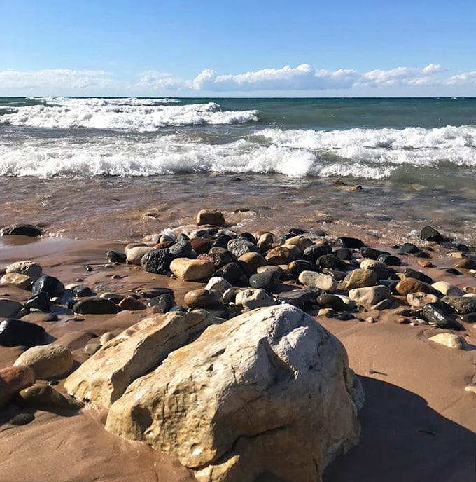 Lake Michigan's waves have spent centuries polishing these stones into a natural mosaic that changes with each passing storm.
