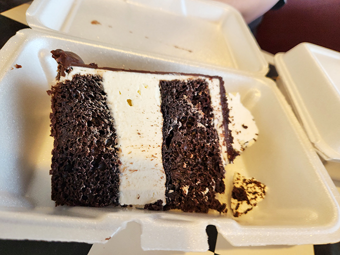 Chocolate cake so rich it should have its own tax bracket &ndash; layers of moist decadence separated by frosting that's worth every calorie.