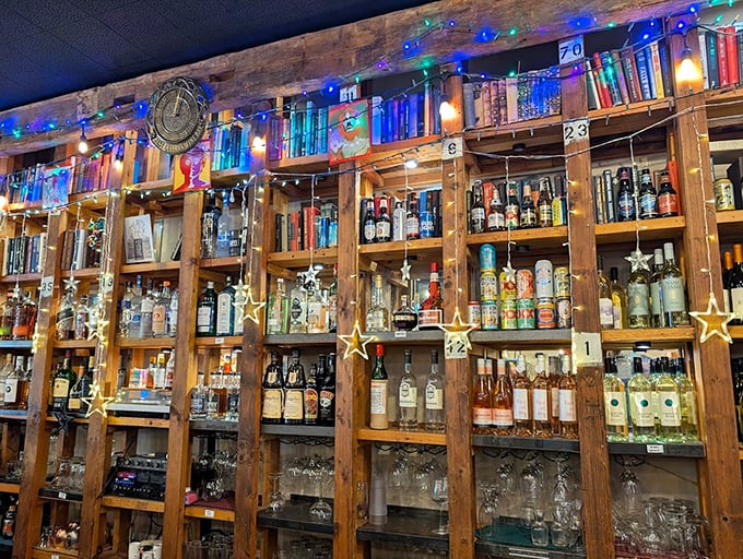 Bottles gleam like literary gems on rustic wooden shelves, offering liquid inspiration for your reading adventures.