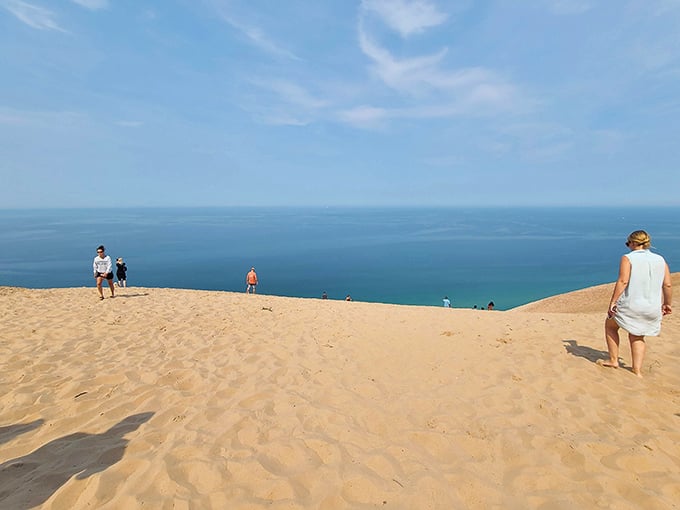 The path to Lake Michigan reveals itself as hikers make their way across the undulating dunes. Sand in shoes: guaranteed.