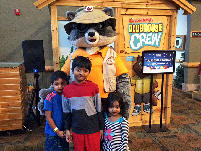 The woodland ambassador himself, decked out in ranger gear, creating photo memories that will outlast even the most epic water slide adventures.