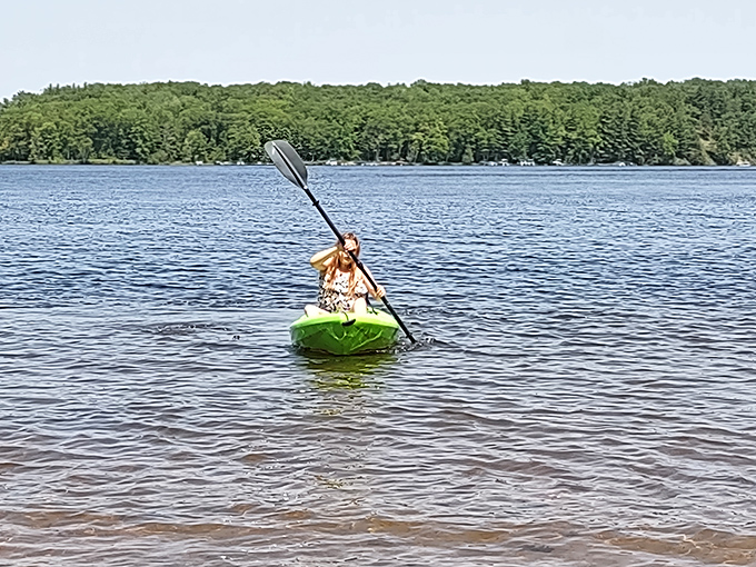 Nothing says "I'm one with nature" like paddling across crystal waters while secretly hoping someone's capturing how outdoorsy you look right now.