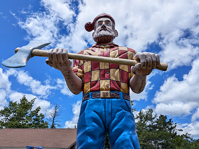 Looking up at Paul's determined expression from below emphasizes just how massive this folk hero stands against the Michigan clouds.