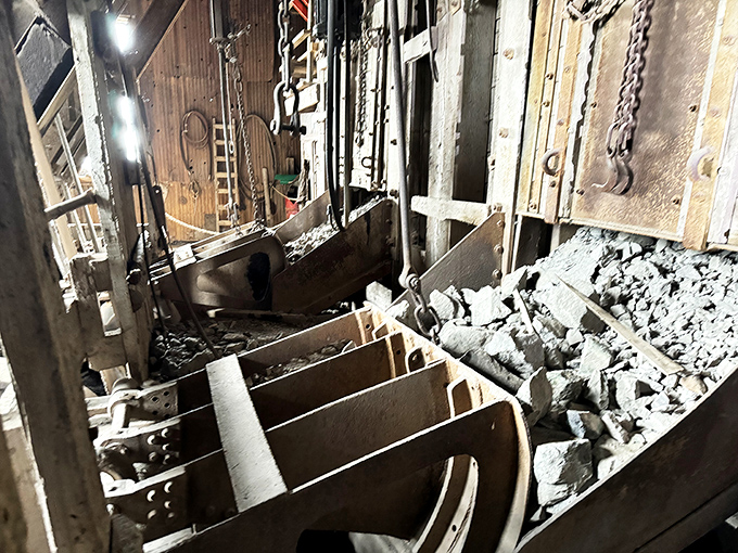 Rusted machinery components sit like industrial sculptures, their original purpose now served only as monuments to human ingenuity and hard labor.