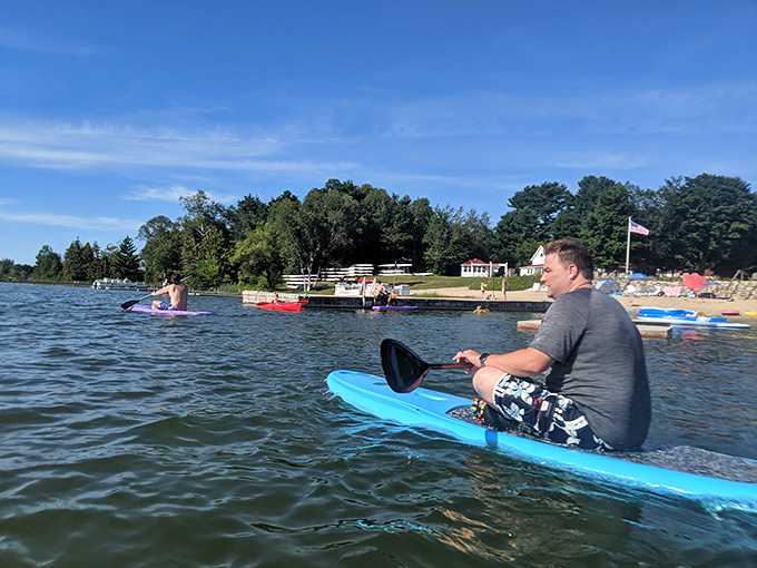 Paddleboarding on Lake Leelanau offers both serenity and adventure – even beginners find themselves gliding across the crystal-clear waters with surprising ease.