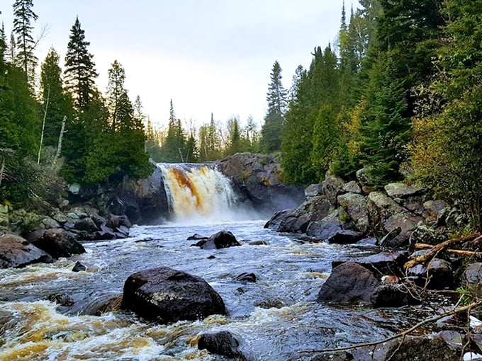 The stream's gentle journey before its dramatic plunge reminds us that life's biggest moments often come after deceptively calm beginnings.