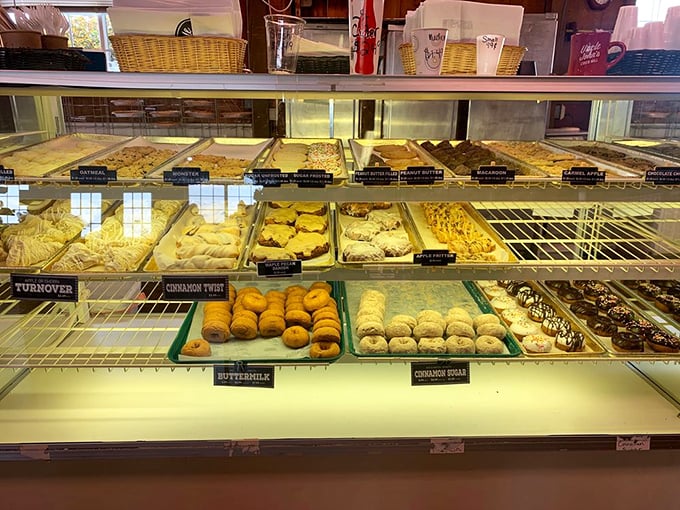 The bakery case displays a treasure trove of pastries that would make grandma both proud and slightly jealous of their perfect golden crusts.