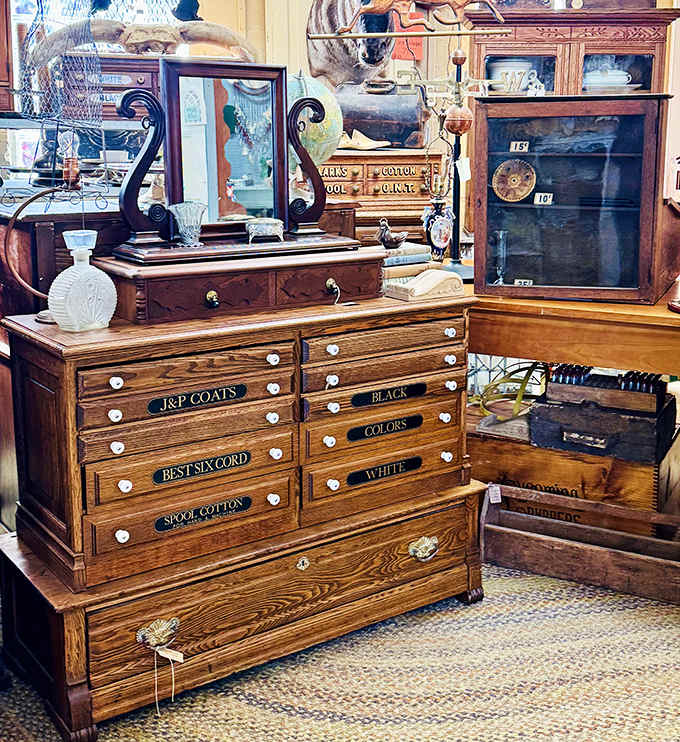 That J&P Coats spool cabinet with its perfectly labeled drawers represents craftsmanship and organization that modern storage solutions can only dream about.