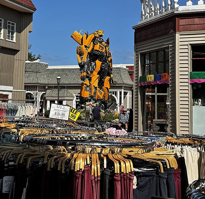 Shoppers browse clothing racks with Mack-A-Tron looming overhead, creating perhaps the most unusual retail therapy experience in the Great Lakes State.