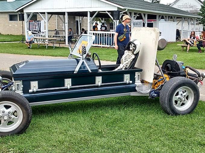 Visitors: Families gather at sunset, creating memories against a backdrop of Michigan's most unusual automotive celebration.