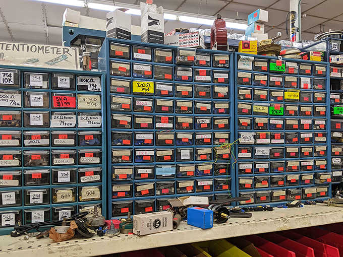 Tiny drawers hold electronic components like a librarian of circuits, each compartment containing possibilities for inventors and tinkerers alike.