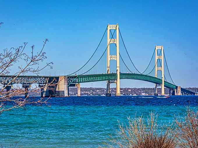 The magnificent Mackinac Bridge spans five miles across the Straits of Mackinac, connecting Michigan's two peninsulas. Its distinctive ivory towers and green suspension cables create an iconic silhouette.