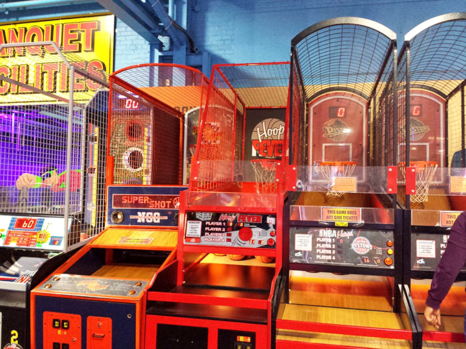 Basketball machines stand ready for sharpshooters, their bright red netting practically begging for your best carnival-style hook shot.