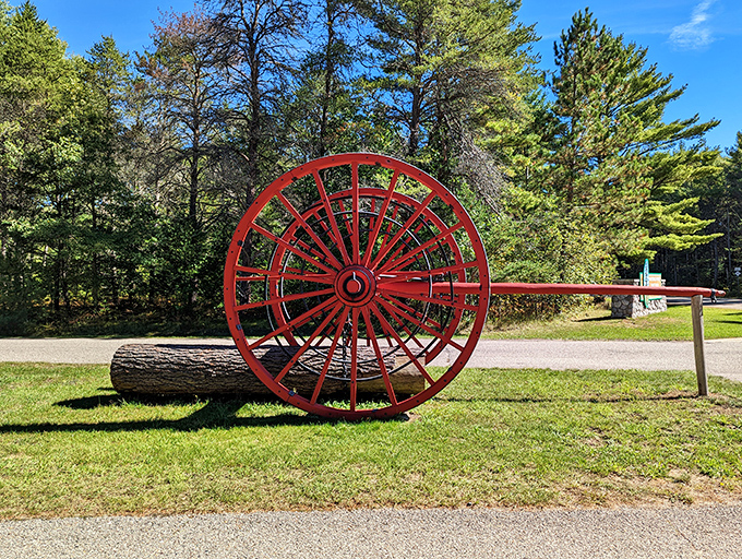 This crimson Big Wheel once hauled massive logs through the forest &ndash; now it stands as a monument to Michigan's logging heritage.