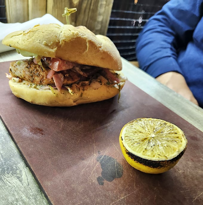 That blackened crust creates a flavor forcefield, sealing in the Mahi's natural juiciness while the toasted bun stands ready for its supporting role.