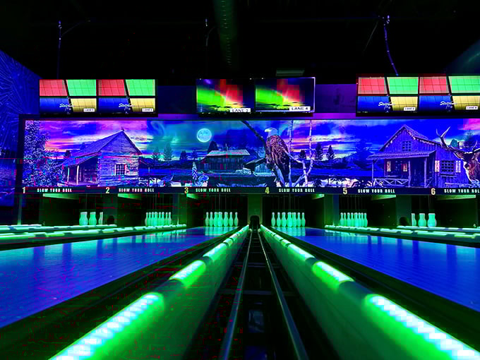 Bowling lanes bathed in ultraviolet splendor make even gutter balls look spectacular against the cosmic backdrop.