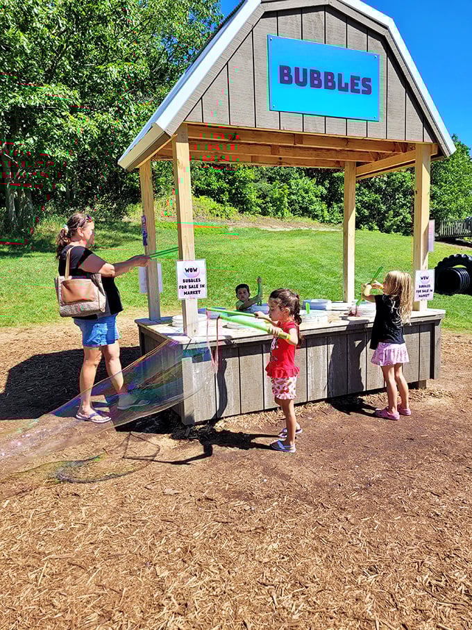 The bubble station proves that sometimes the simplest pleasures create the biggest smiles, as children chase shimmering spheres across the farm.