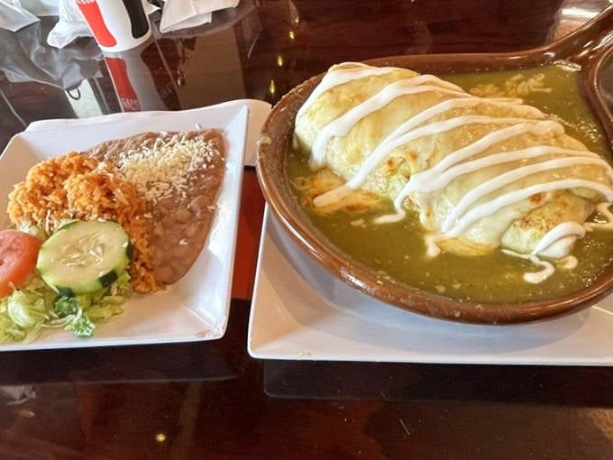 The Burrito Ahogado takes swimming lessons in a bath of vibrant sauce, transforming from mere meal to fork-and-knife experience that'll have you sopping up every last drop.