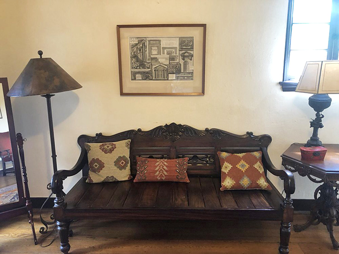 This carved bench looks like it could tell tales of generations past, the kind of furniture piece that makes IKEA weep with inadequacy.