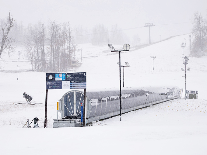 Snow-covered loading station stands ready for winter enthusiasts. Where adventures begin and hot chocolate cravings are born!