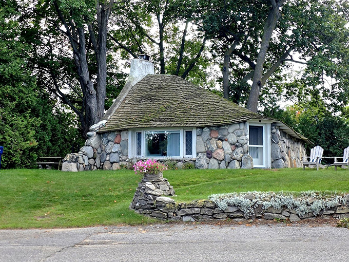 The rounded, hobbit-like entrance beckons visitors into a world where right angles are optional and imagination rules the architectural roost.