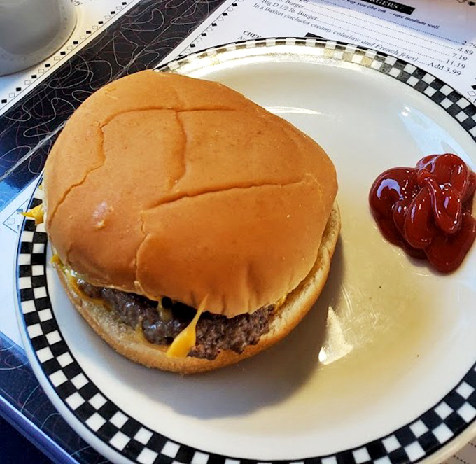 Simplicity perfected – a classic cheeseburger with a side of ketchup that would make even fancy steakhouse burgers jealous.