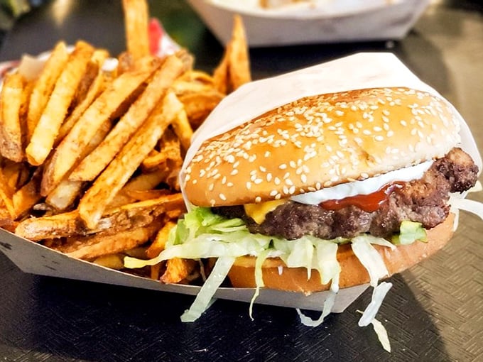 This isn't just a cheeseburger – it's comfort food elevated to art form status, with crispy-edged patty and fresh toppings.