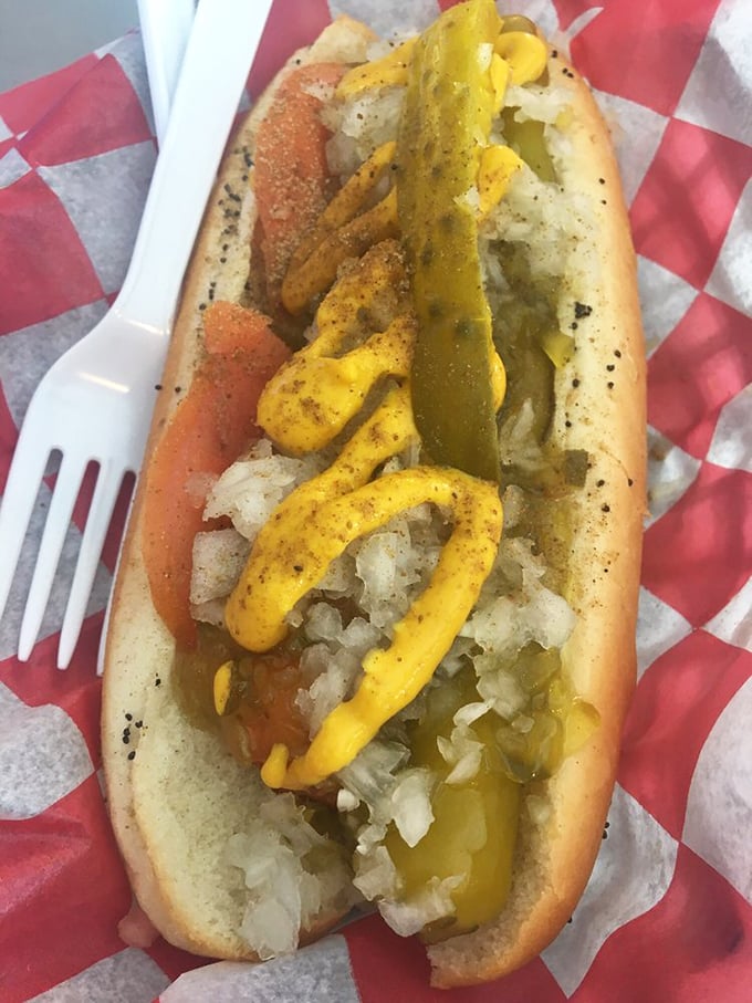 The Chicago dog comes fully loaded with that signature neon green relish, sport peppers, and all the proper fixings a Windy City classic demands.