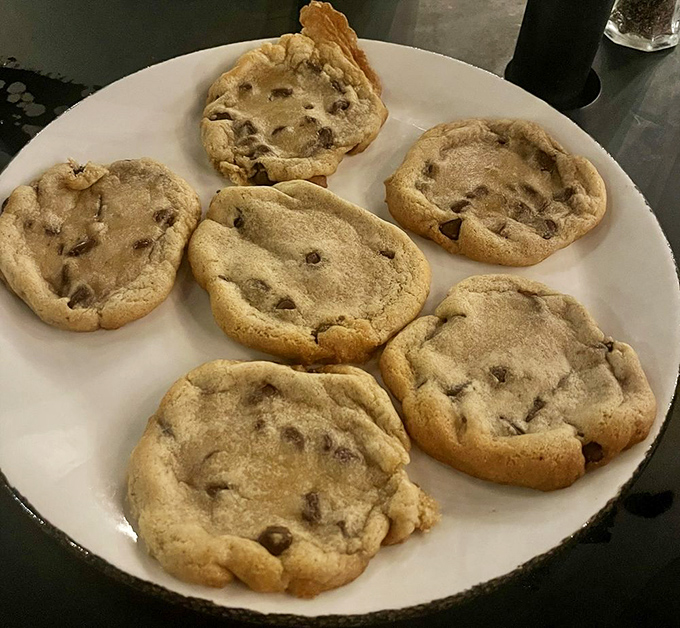 These chocolate chip cookies aren't just dessert, they're an experience, arriving warm with perfectly melted chips that make sharing an exercise in willpower.