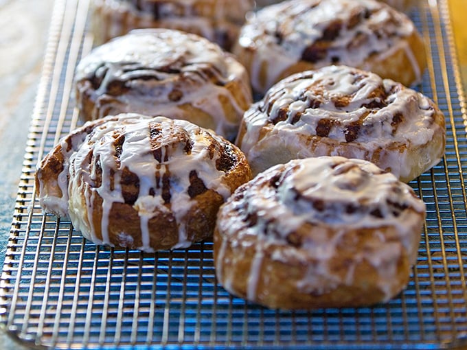 Cinnamon Rolls: Gloriously oversized spirals of buttery dough with cream cheese frosting that melts into warm, cinnamon-spiced crevices. Pure morning bliss!