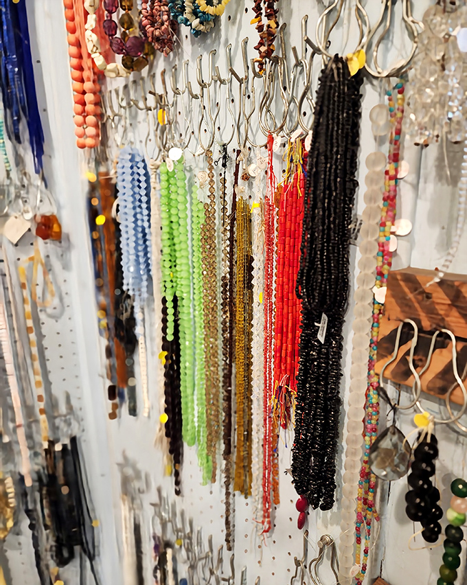Beads in every imaginable hue hang in organized chaos &ndash; from delicate glass seed beads to substantial wooden pieces carved by artisans across Africa.