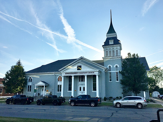 Crossroads Community Church stands as a spiritual landmark in Adrian, its steeple reaching skyward like a beacon of faith and community connection.