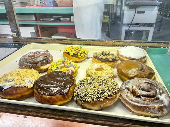 Rows of donuts standing at attention like the world's most delicious army, ready to wage war on your diet and win every single battle with style.