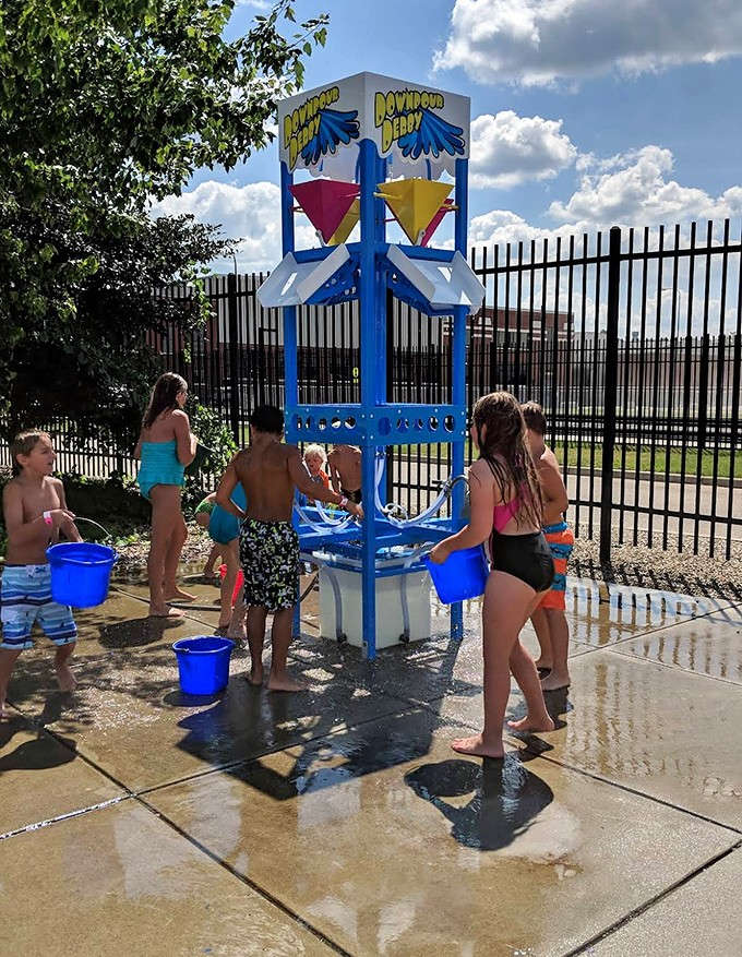 Downpour Derby challenges visitors to fill buckets and trigger massive water dumps, proving that getting soaked is always more fun with friends.