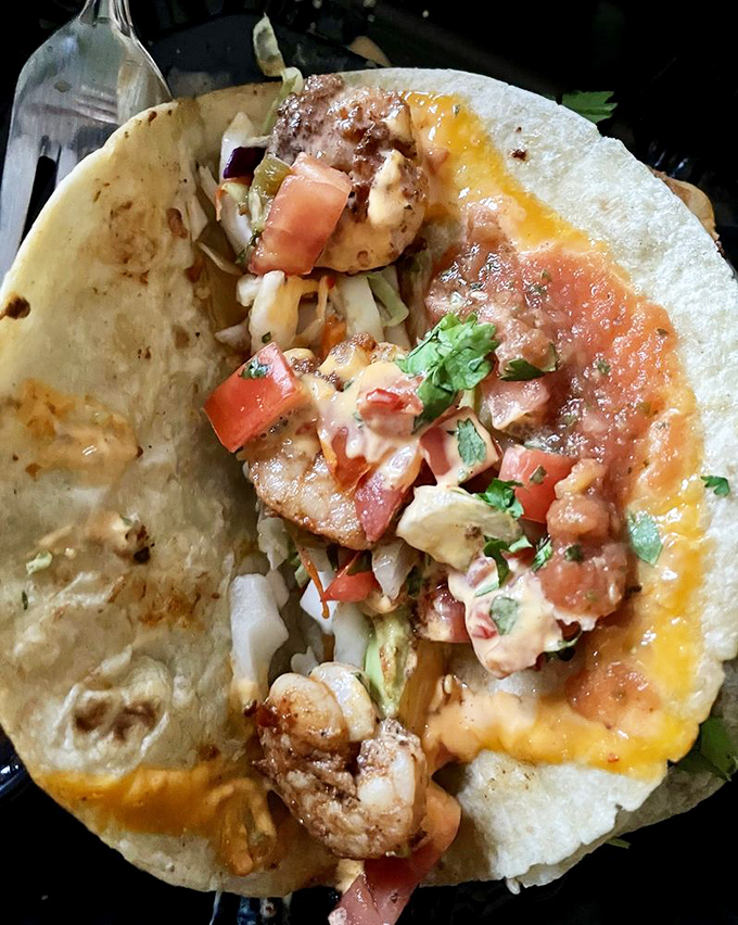 These Dynamite Shrimp Tacos deliver on their explosive name, with plump shrimp, fresh pico, and melted cheese creating flavor fireworks.