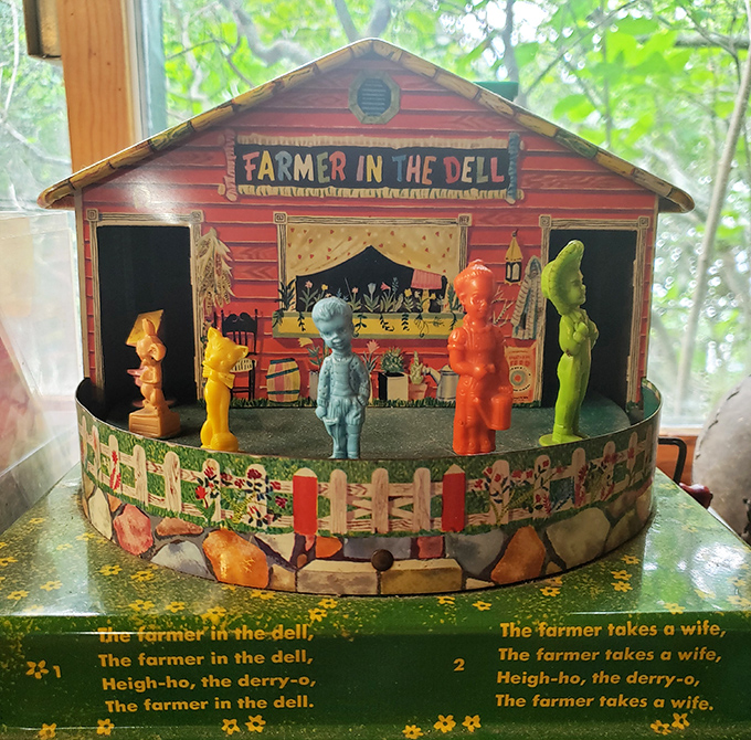This "Farmer in the Dell" musical toy set captures the simple joy of mid-century playthings, when imagination filled in what technology couldn't provide.