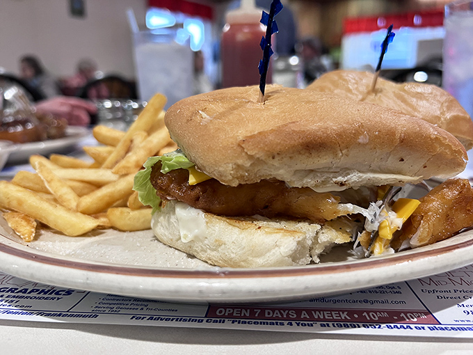A sandwich that means business – stacked high with crispy fish, melty cheese, and fresh toppings on a bun that actually tastes like bread.