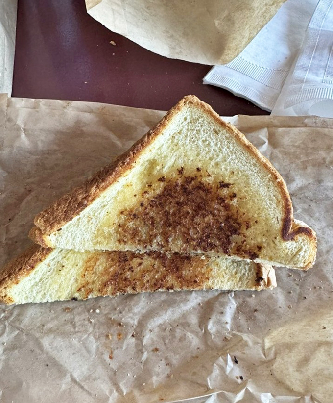 Golden-brown garlic bread, the unsung hero of any pasta meal, ready to sop up every last drop of that homestyle sauce.