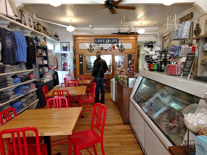Bright red chairs invite visitors to linger over coffee and conversation in this community gathering spot.