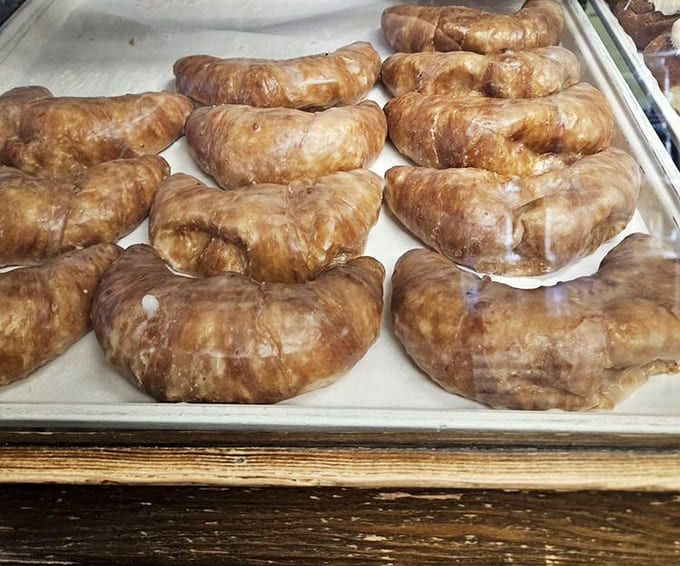 Golden, flaky croissants glisten under bakery lights, promising buttery layers that shatter delicately with each bite &ndash; breakfast nirvana awaits.