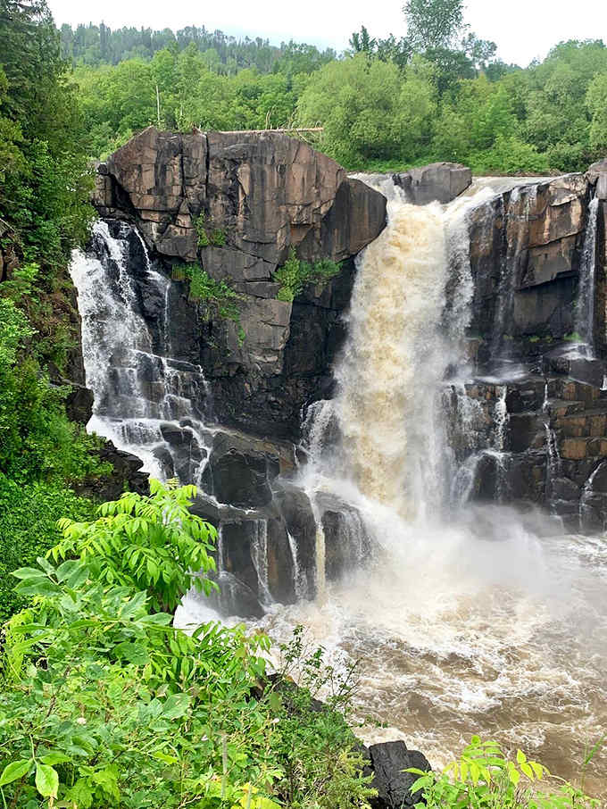 Drama in three acts: High Falls splits into distinct channels during normal flow, each stream carving its own path down the rugged cliff face.