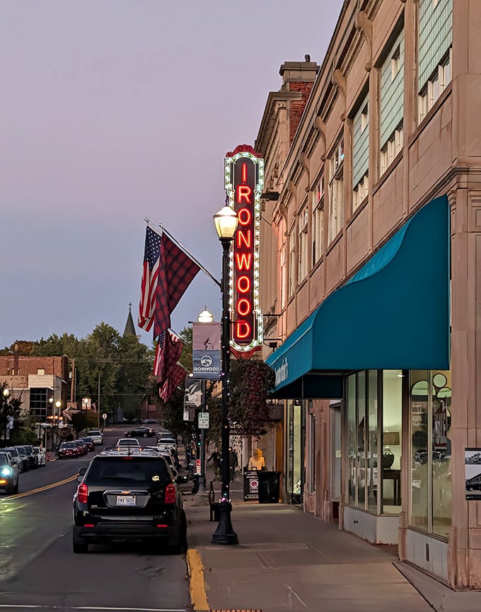 As dusk settles over Ironwood, the Historic Theatre's vertical sign glows like a beacon, drawing locals and visitors to its timeless entertainment.