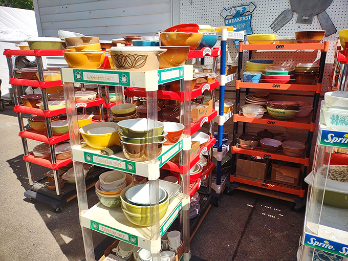 Colorful vintage kitchenware creates a rainbow of nostalgia, with Pyrex bowls and forgotten gadgets waiting to return to active duty.