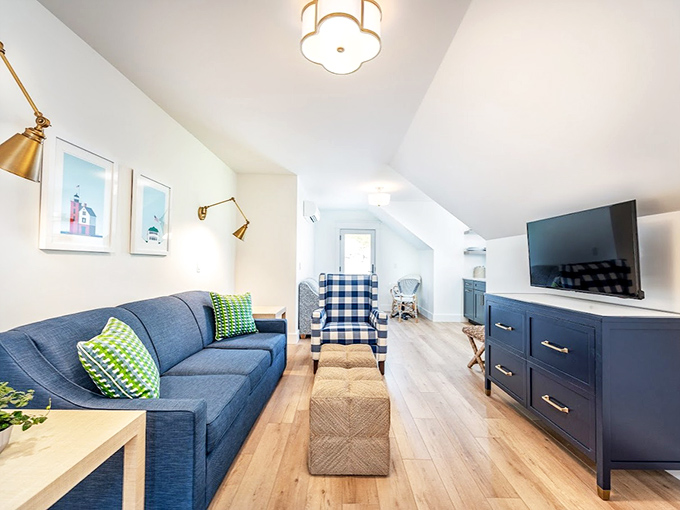 Lounge: Navy accents and comfortable seating create a gathering space where strangers become friends over morning coffee and evening wine.