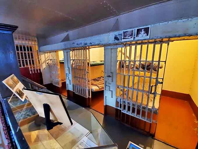 Cold steel and stark yellow walls define the main cell block, where visitors can experience the claustrophobic reality of Victorian-era incarceration.