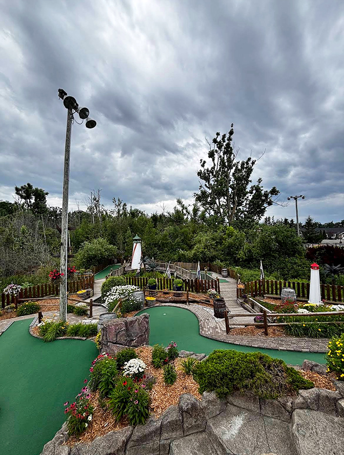 Storm clouds gather dramatically over the course, adding an authentic high-seas atmosphere to your putting adventure without the seasickness.