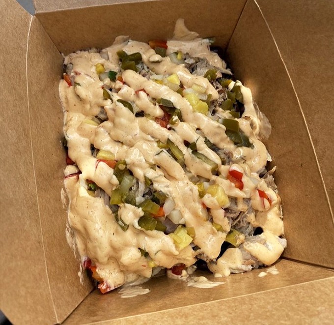 Nachos that don't apologize for being awesome &ndash; layers of chips, beans, cheese, and veggies creating a mountain worth climbing with every bite.