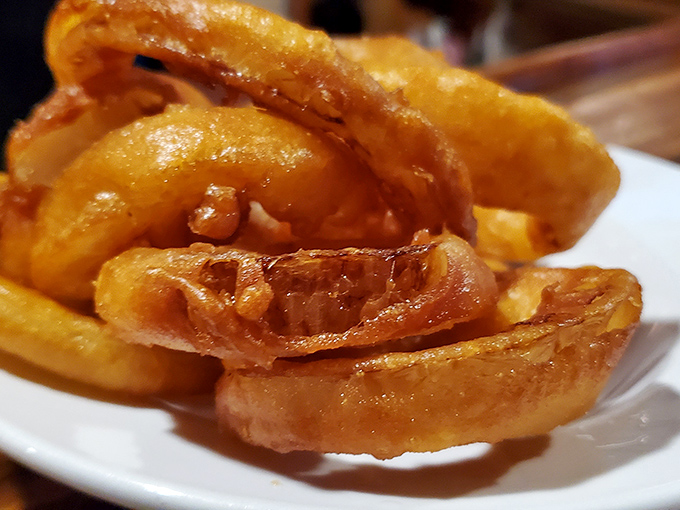These aren't ordinary onion rings &ndash; they're crispy golden halos of happiness that shatter satisfyingly with each bite.