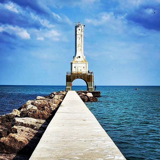 The lighthouse stands like a maritime exclamation point at the end of the breakwater, daring Lake Michigan to bring its worst.